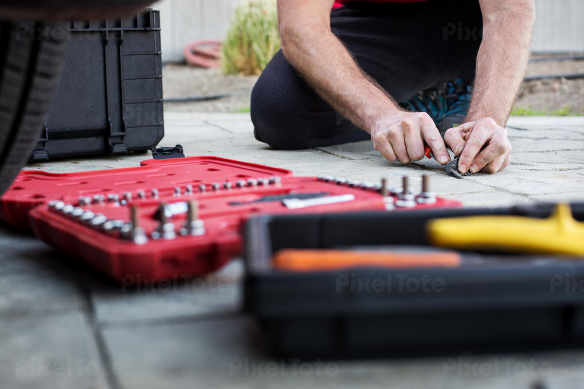 Handy Man Working on a Project Stock Photo - PixelTote