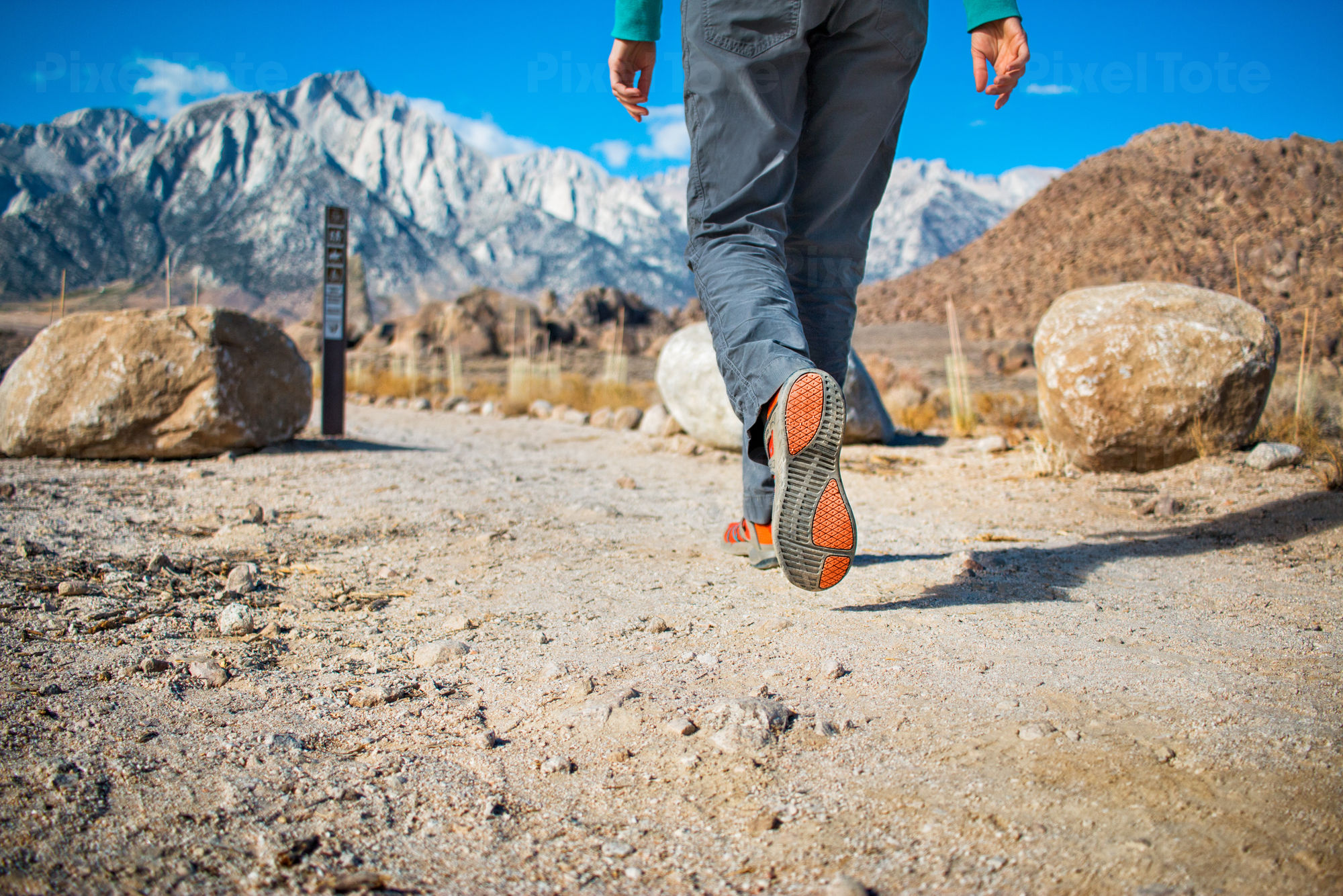 Low-Angle View of a Woman Walking Stock Photo - PixelTote
