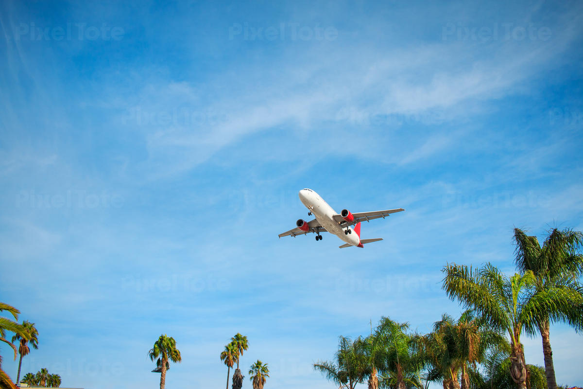 Commercial Airplane in Flight Stock Photo - PixelTote