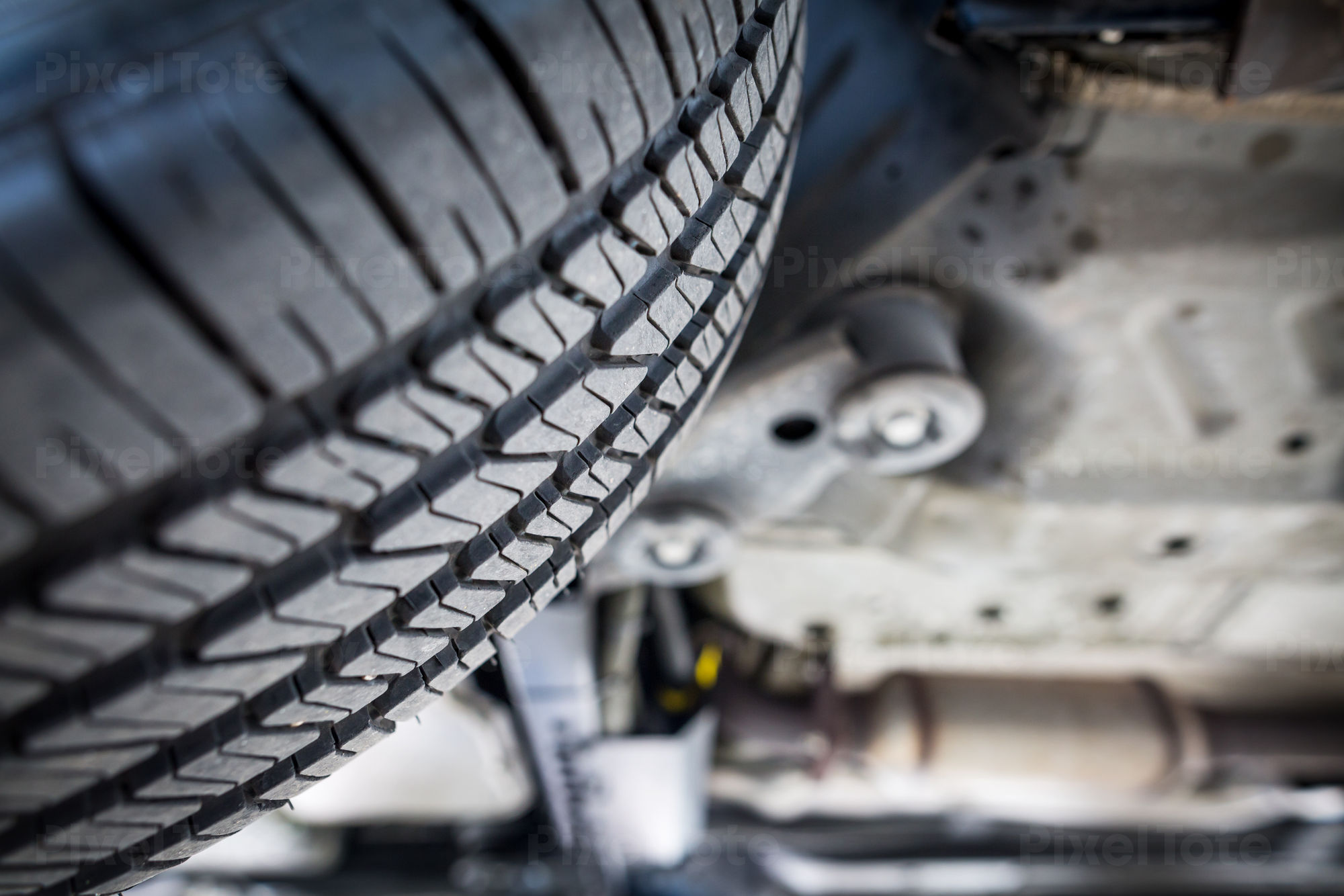 Bottom View of a Car with Close-Up Stock Photo - PixelTote