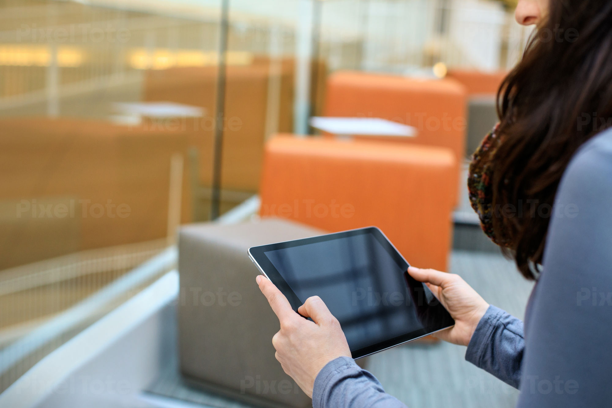 Over-the-Shoulder View of a Woman Stock Photo - PixelTote