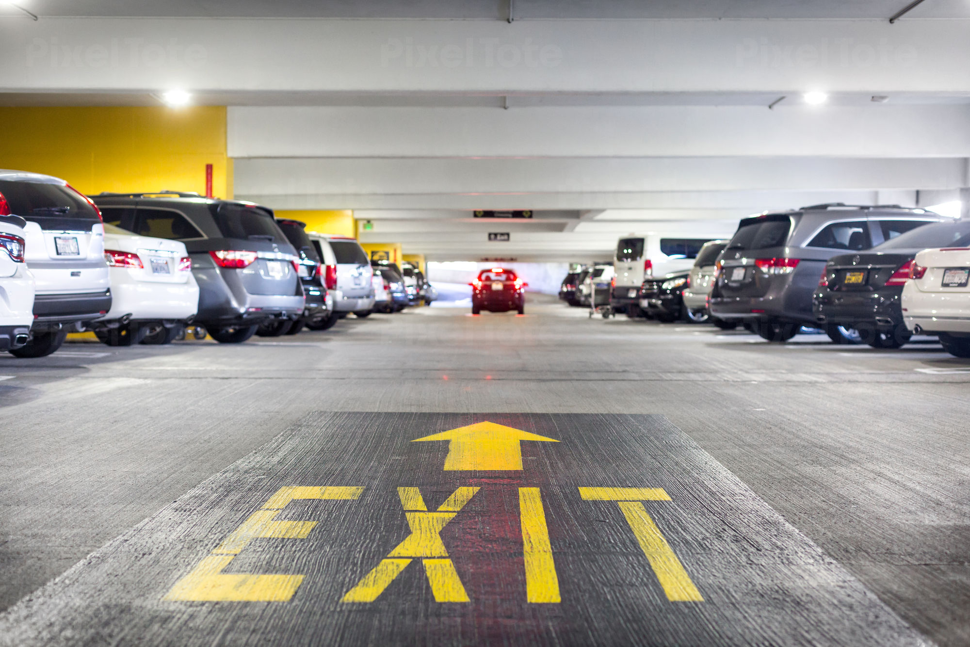 Exit Sign at a Parking Garage Stock Photo - PixelTote