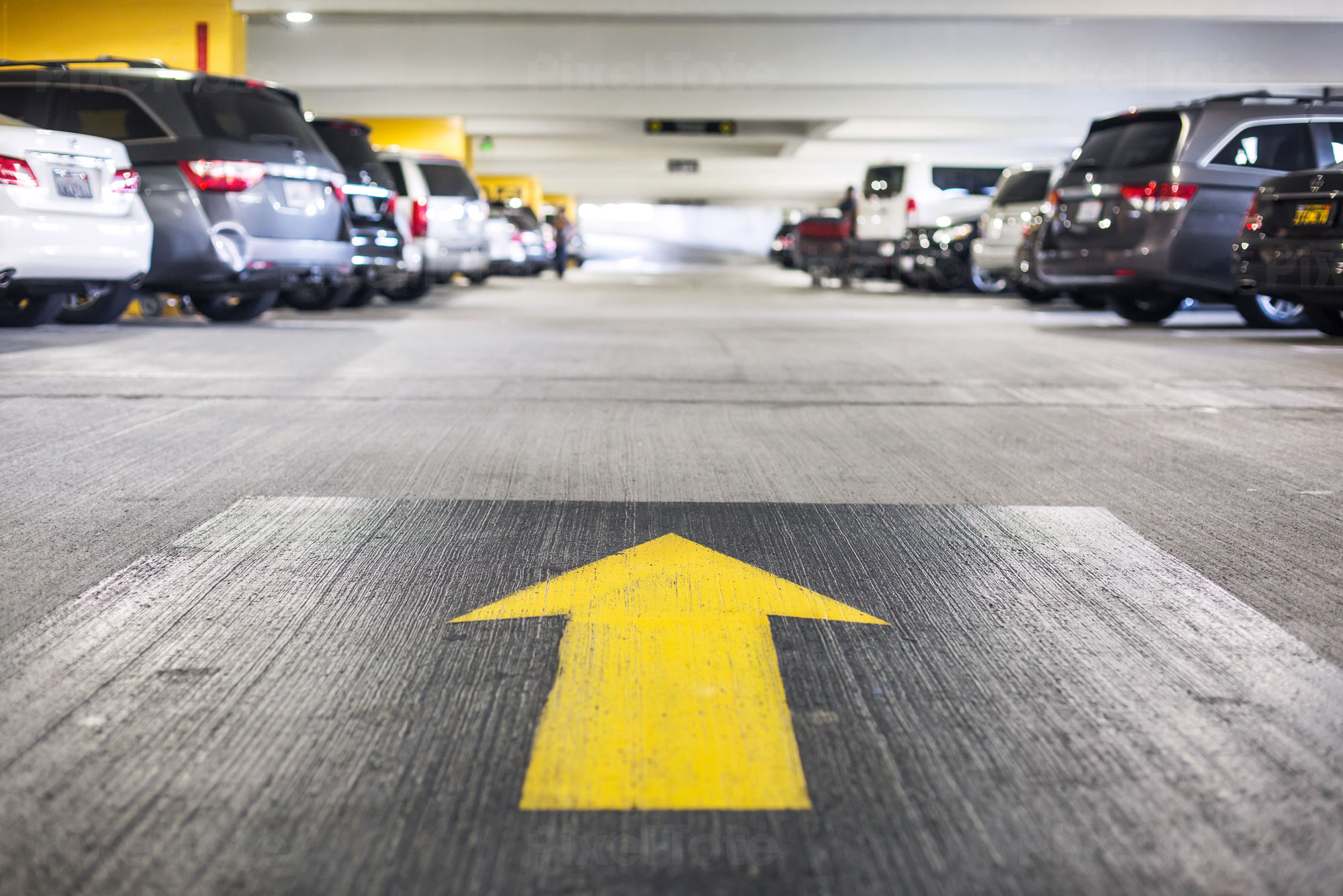 Arrow Sign Pointing to an Exit Stock Photo - PixelTote