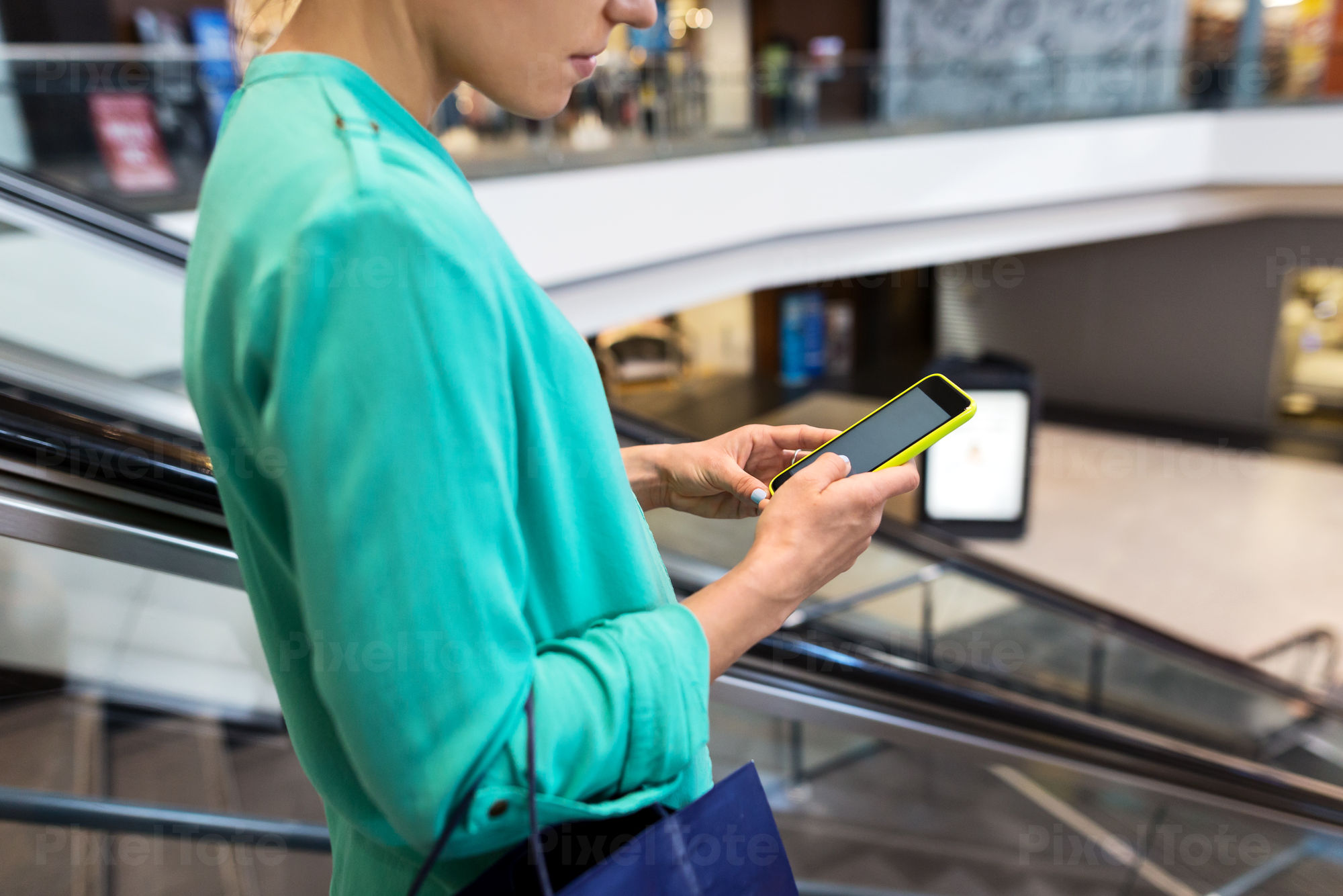 Girl with a Cell Phone Standing Stock Photo - PixelTote