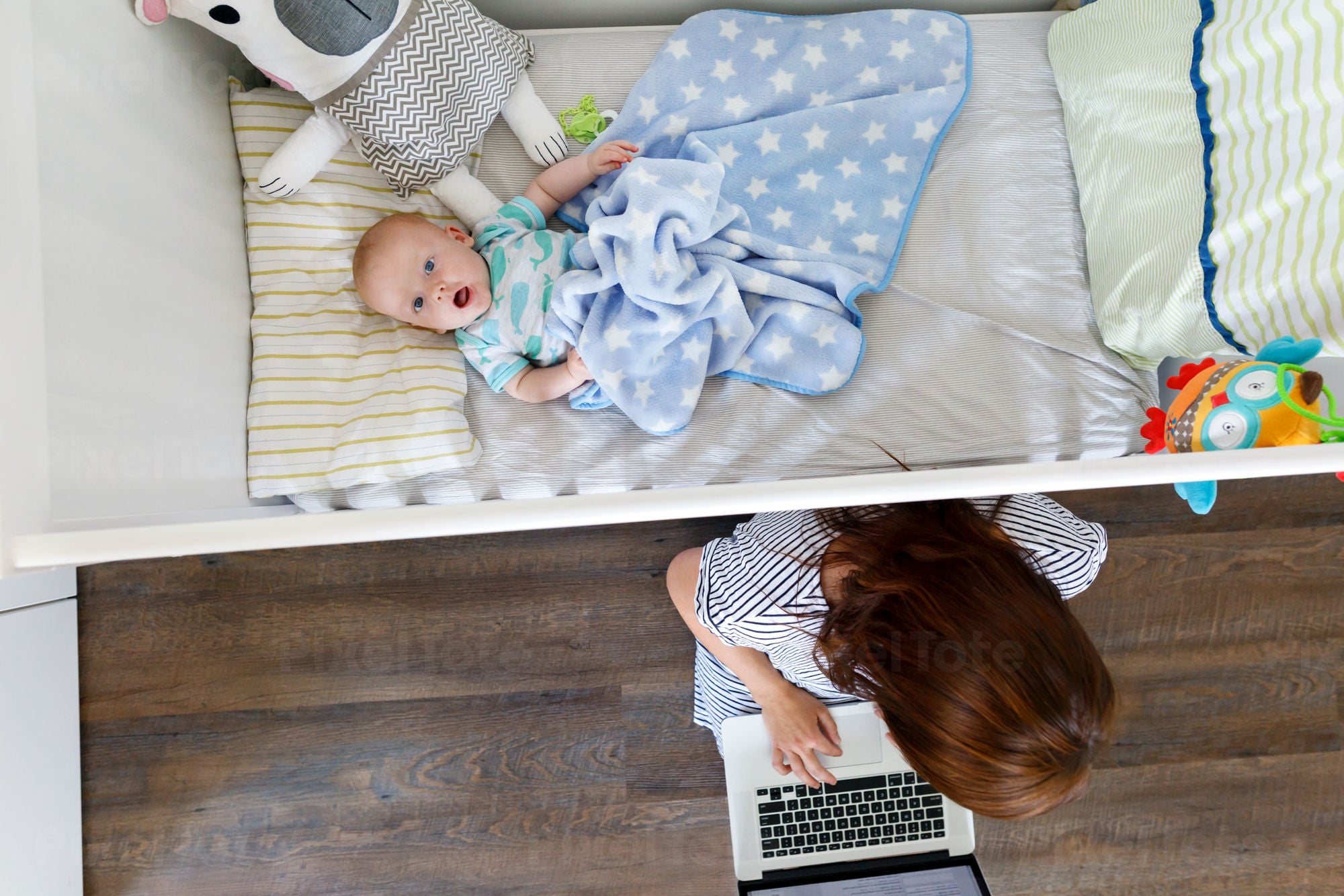 Overhead View of a Baby in a Stock Photo - PixelTote