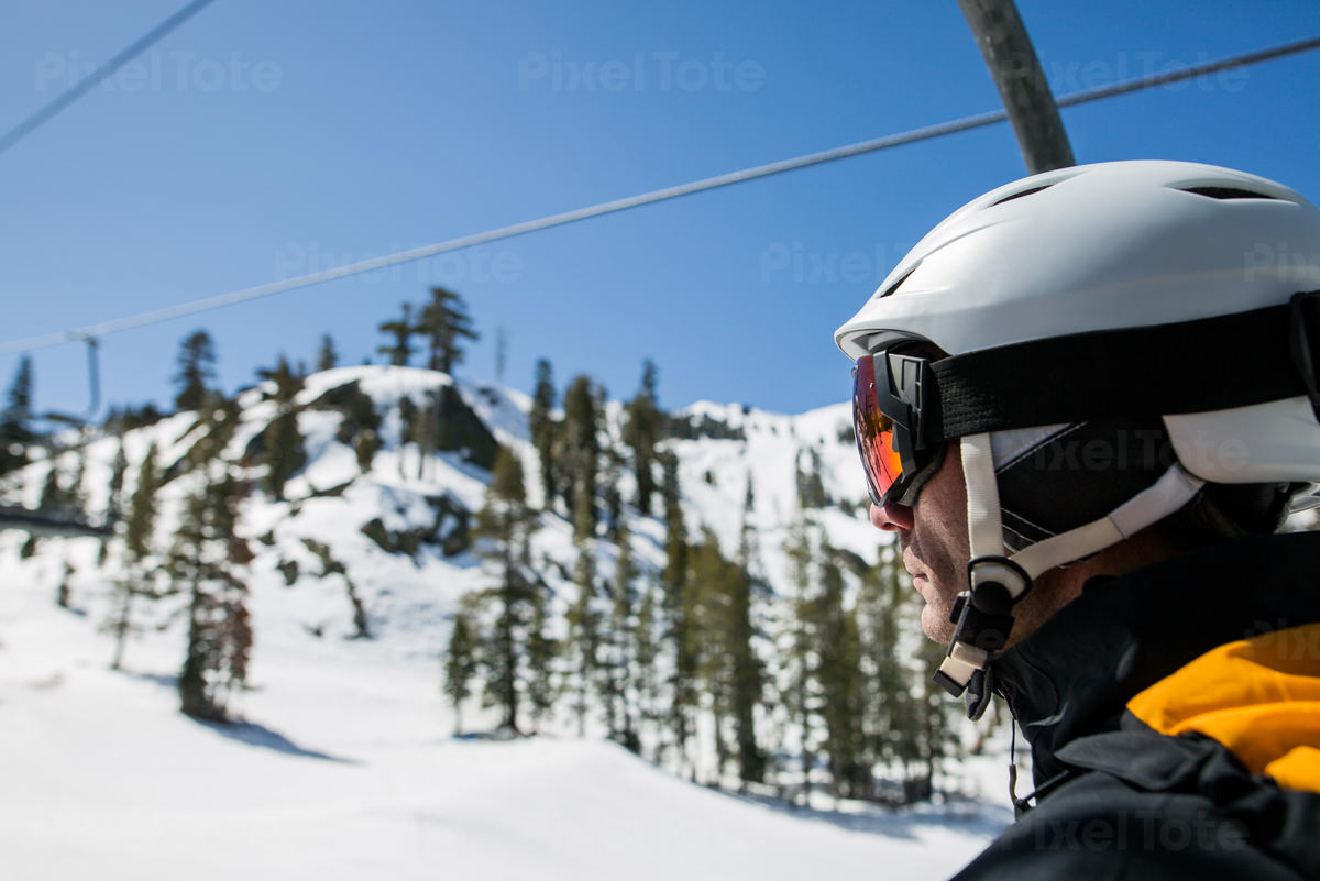Close-Up of a Male Skier Sitting Stock Photo - PixelTote