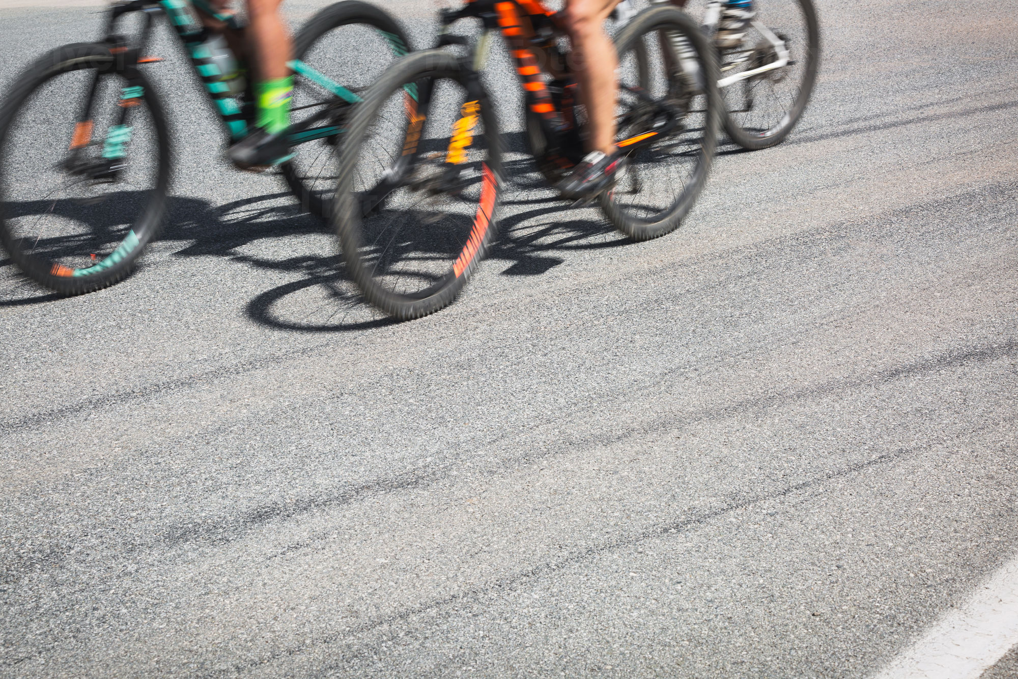 Blurred Road Bikes on an Asphalt Stock Photo - PixelTote