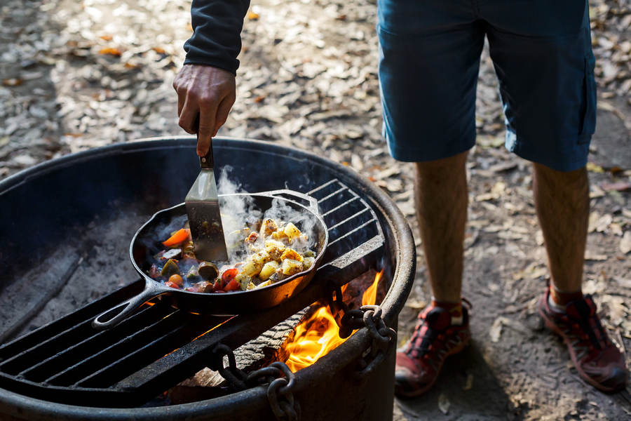 Man Cooking Breakfast on a Skillet Stock Photo - PixelTote