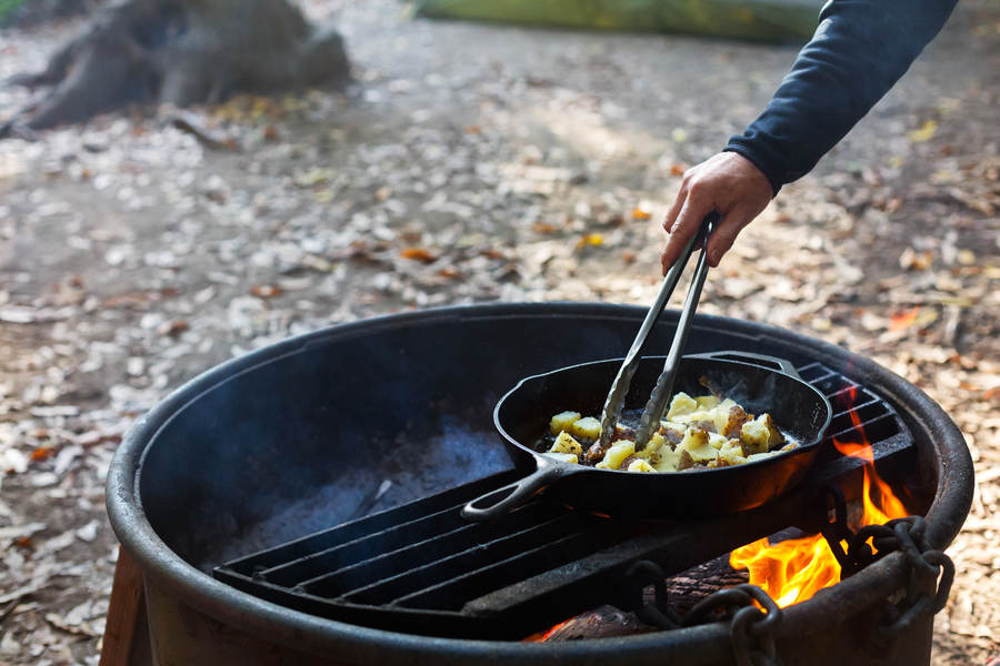 Close-up of a Man Cooking Breakfast Stock Photo - PixelTote