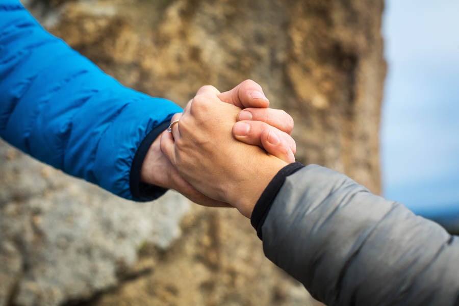 Close-Up of a Man Grasping Woman's Stock Photo - PixelTote