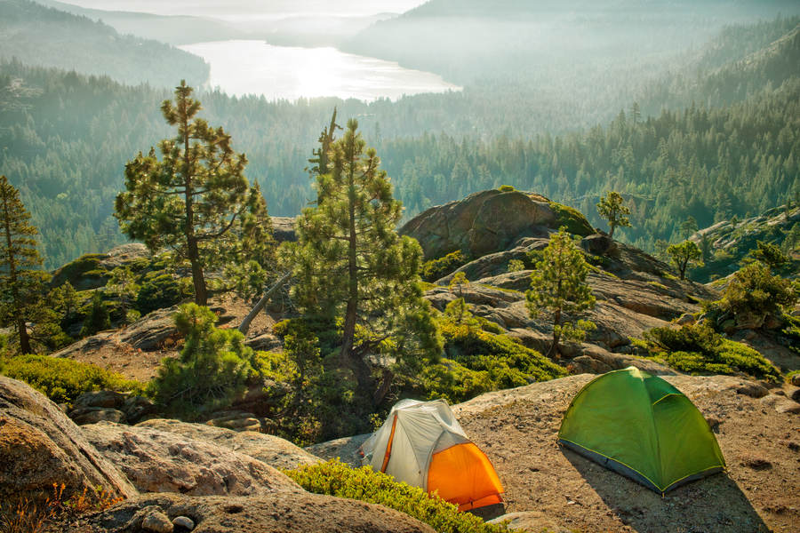 Two Tents Pitched on a Ledge Stock Photo - PixelTote