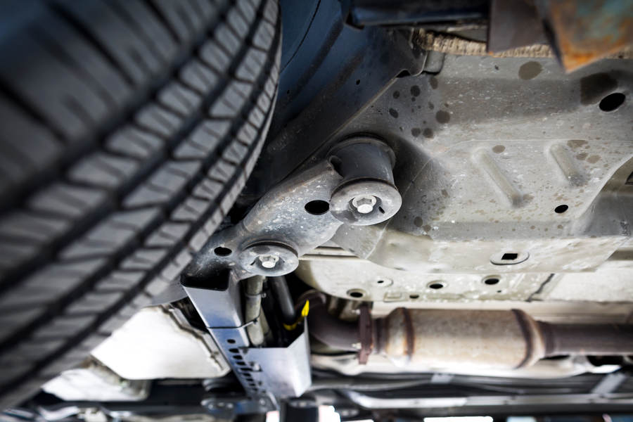 Close-Up Bottom View of a Car Stock Photo - PixelTote