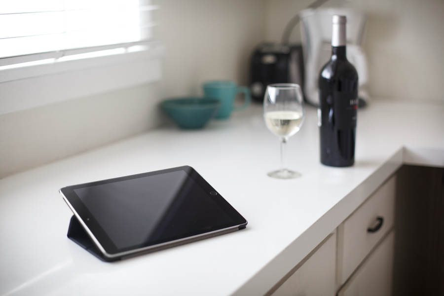 Digital Tablet on a Kitchen Counter Stock Photo - PixelTote