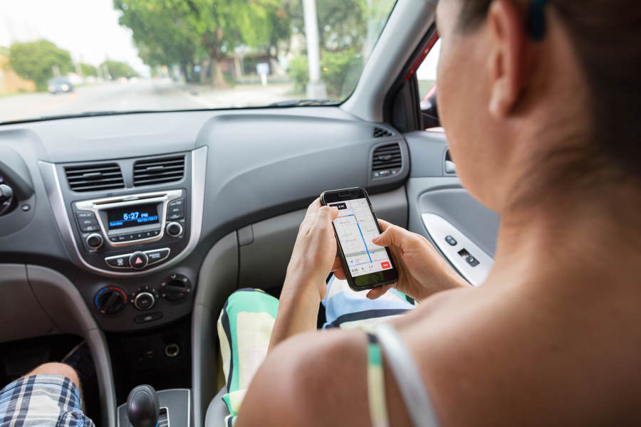 Female Front Seat Passenger Using Stock Photo - PixelTote
